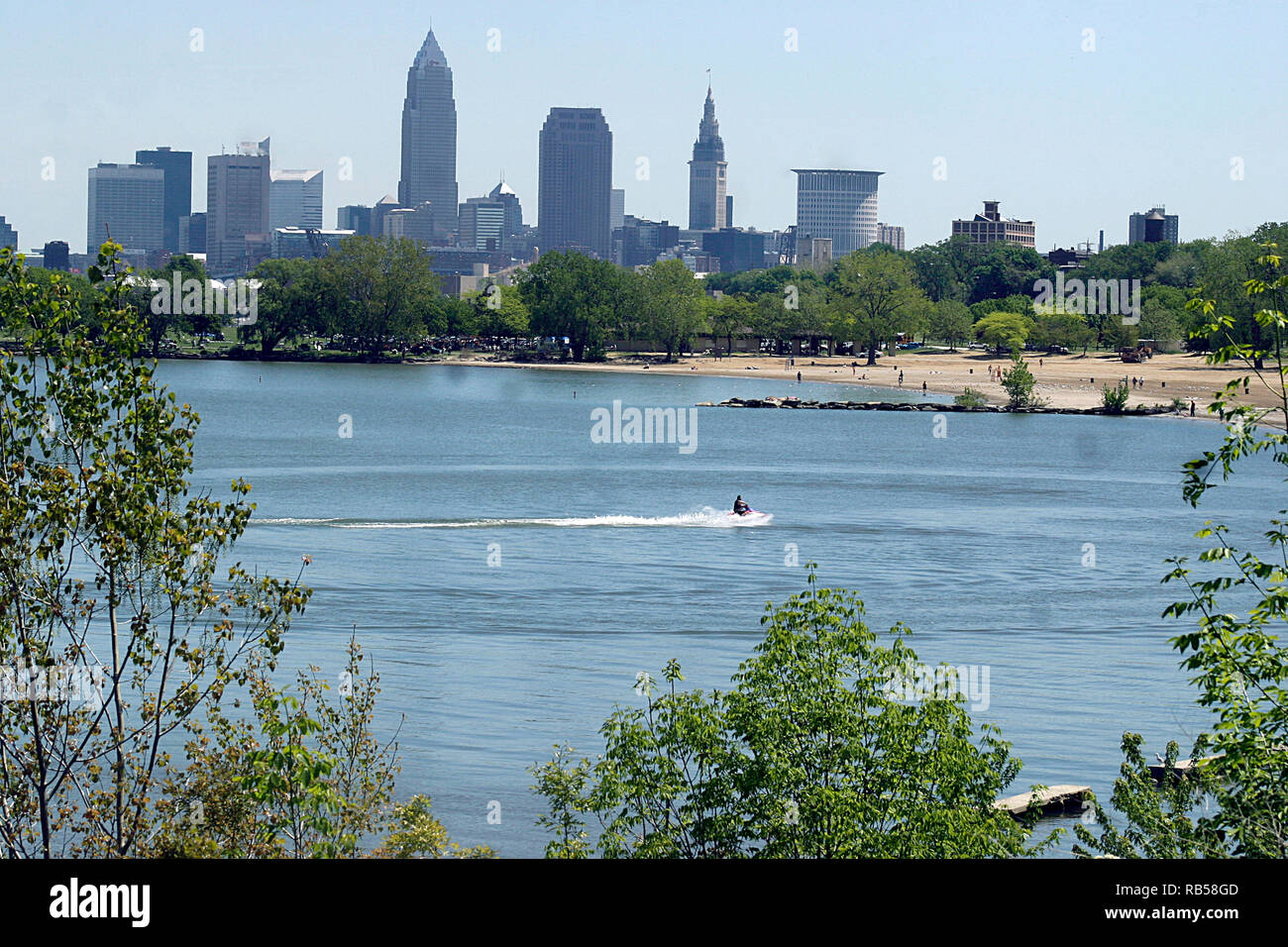 Cleveland, OH, USA. Person riding a water scooter on Lake Erie. View of ...