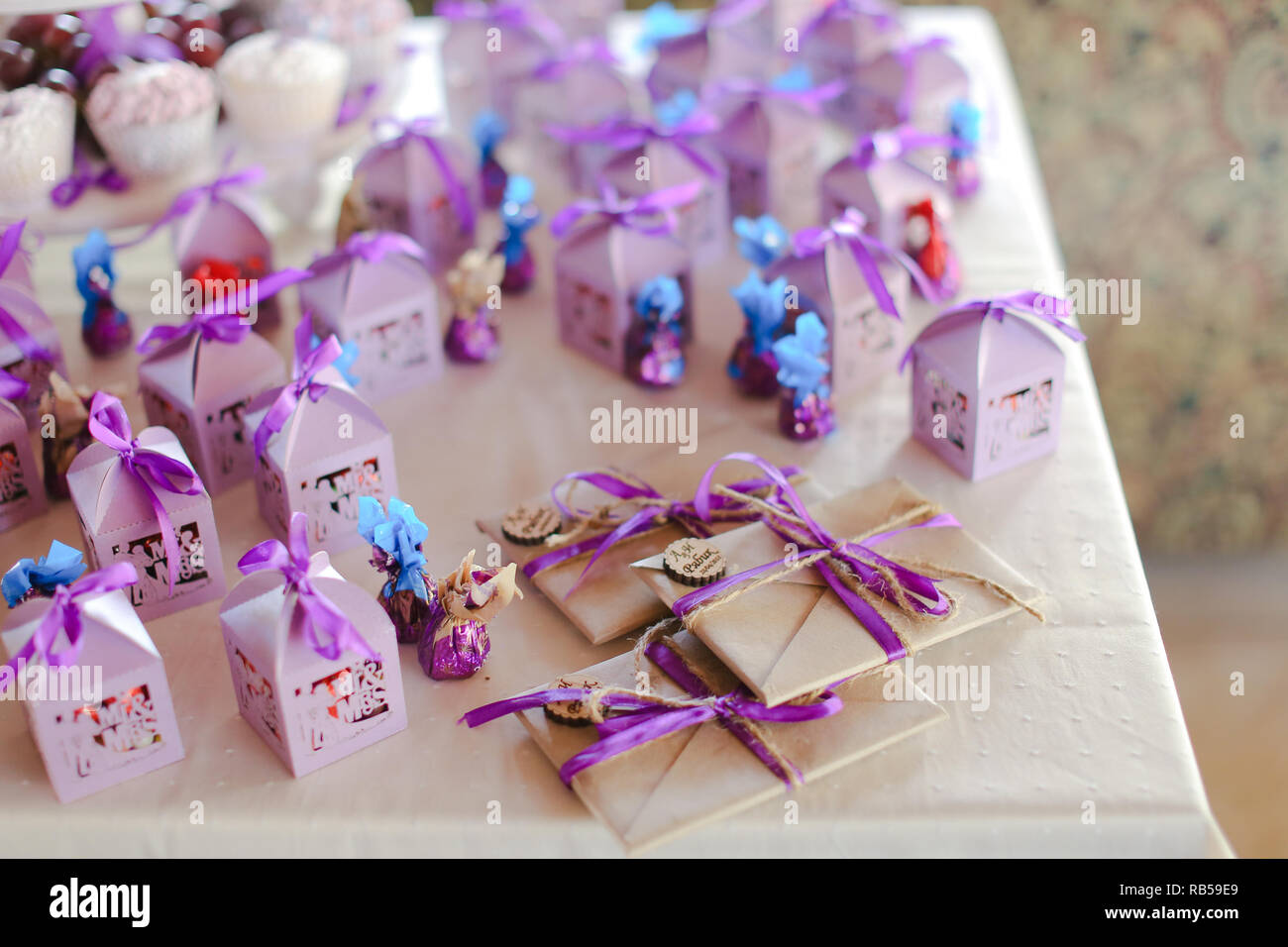 Nice violet decorations for birthday party, sweets and envelopes Stock ...