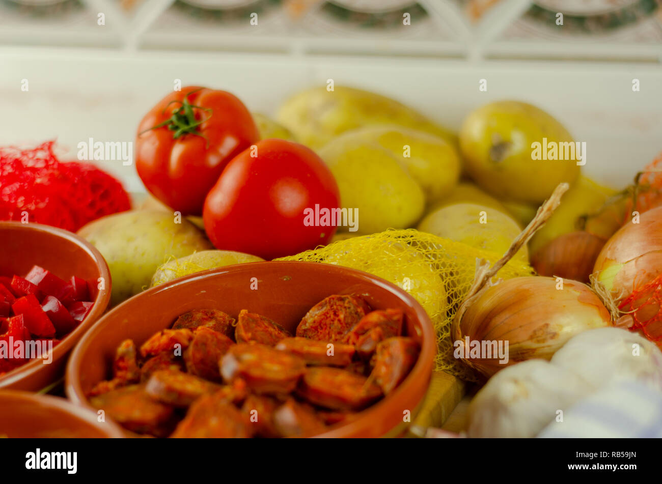 prepared fresh ingredients for cooking goulash with chorizo sausage ...
