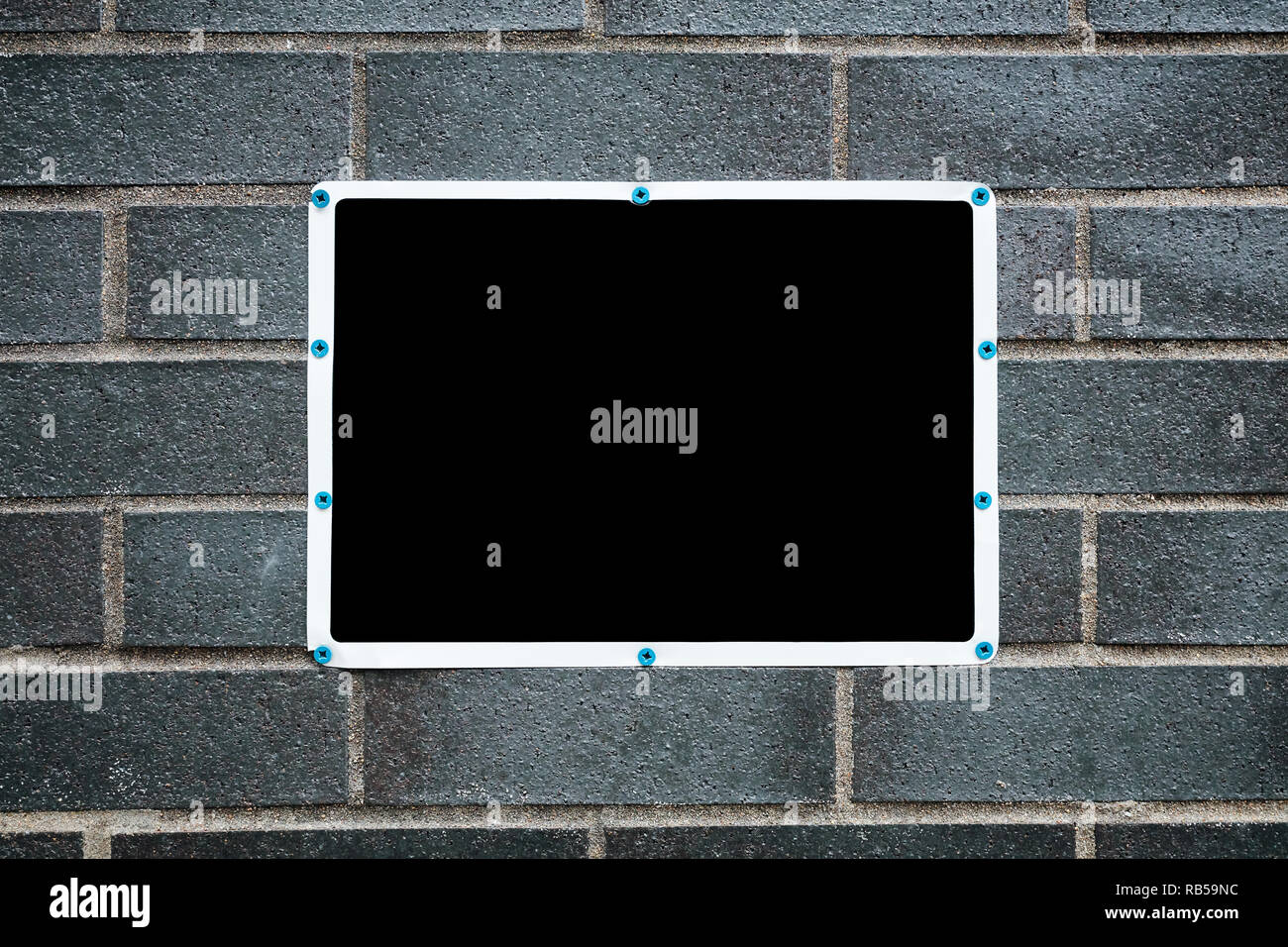 Black sign white brick wall hi-res stock photography and images - Alamy