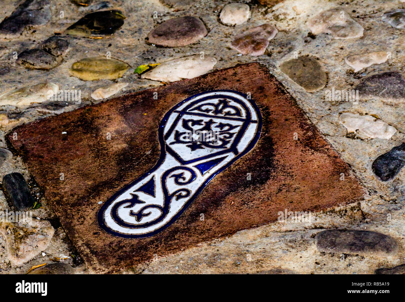 ceramic tile with an element of reflection of the human foot, a ...
