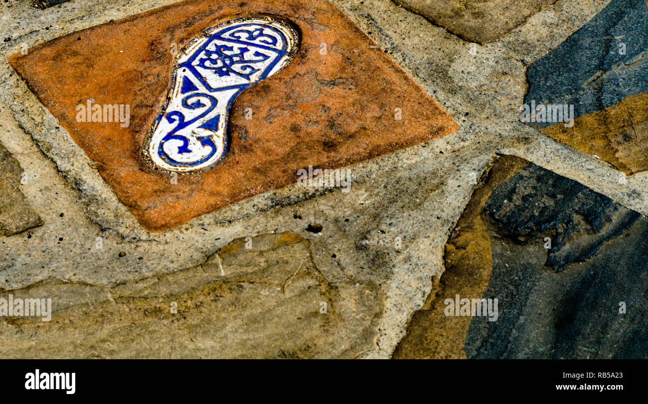 ceramic tile with an element of reflection of the human foot, a ...