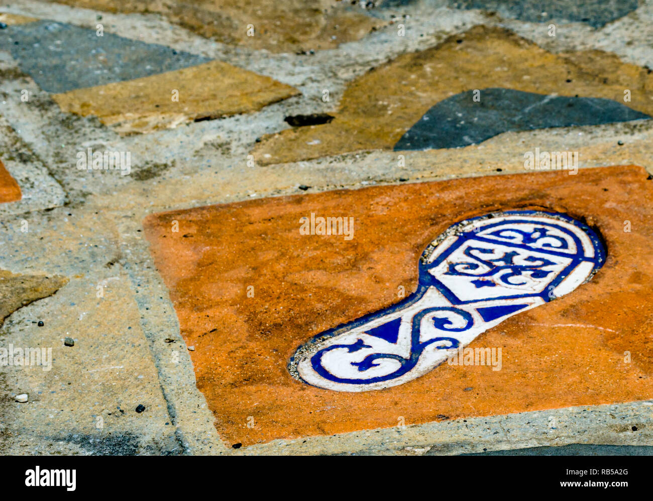 ceramic tile with an element of reflection of the human foot, a ...