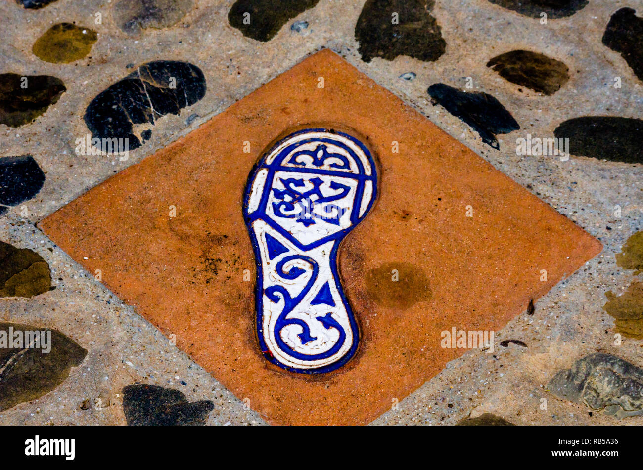 ceramic tile with an element of reflection of the human foot, a ...