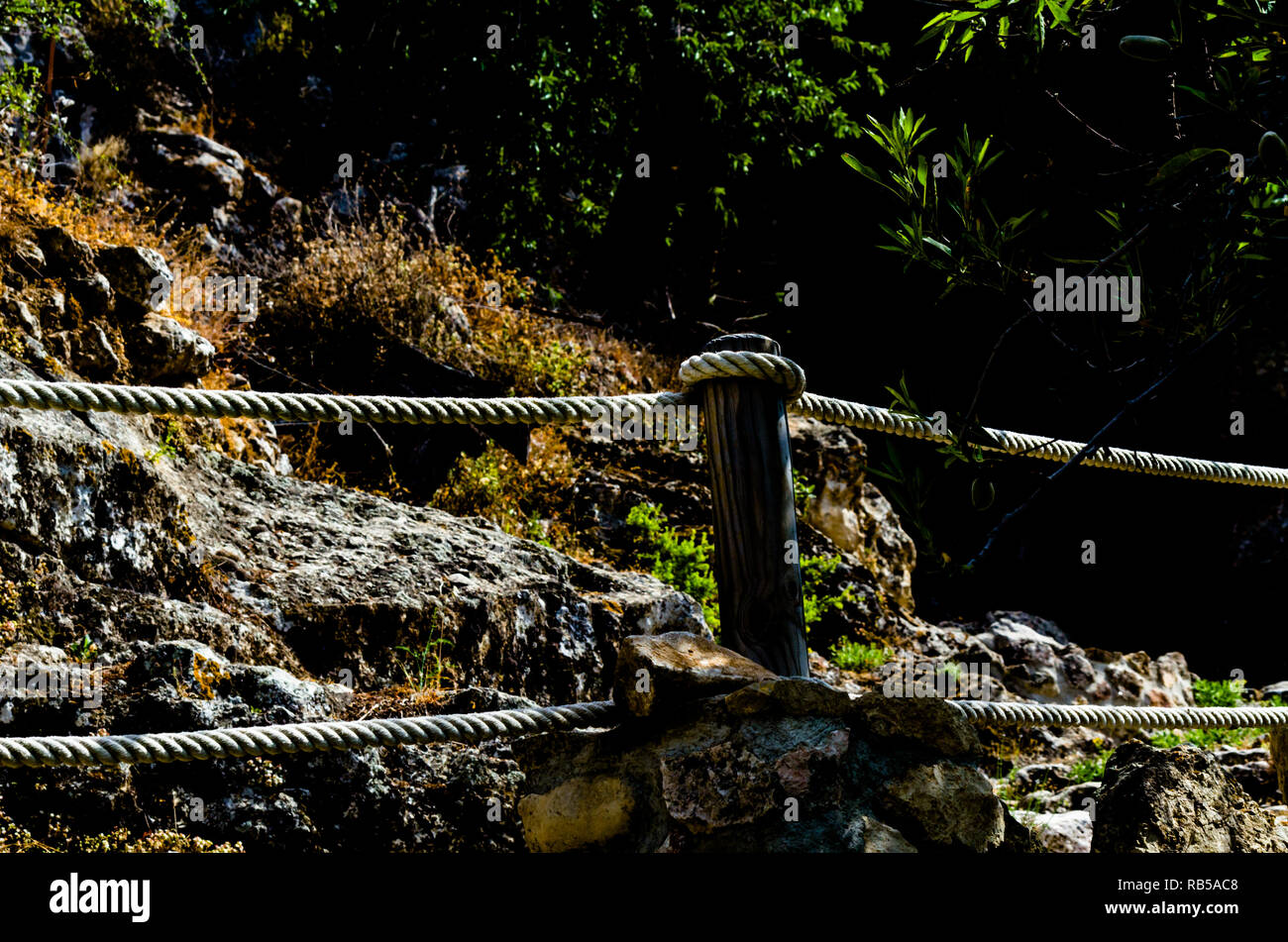 tourist path in a mountainous Spanish town, a pedestrian trail secured ...