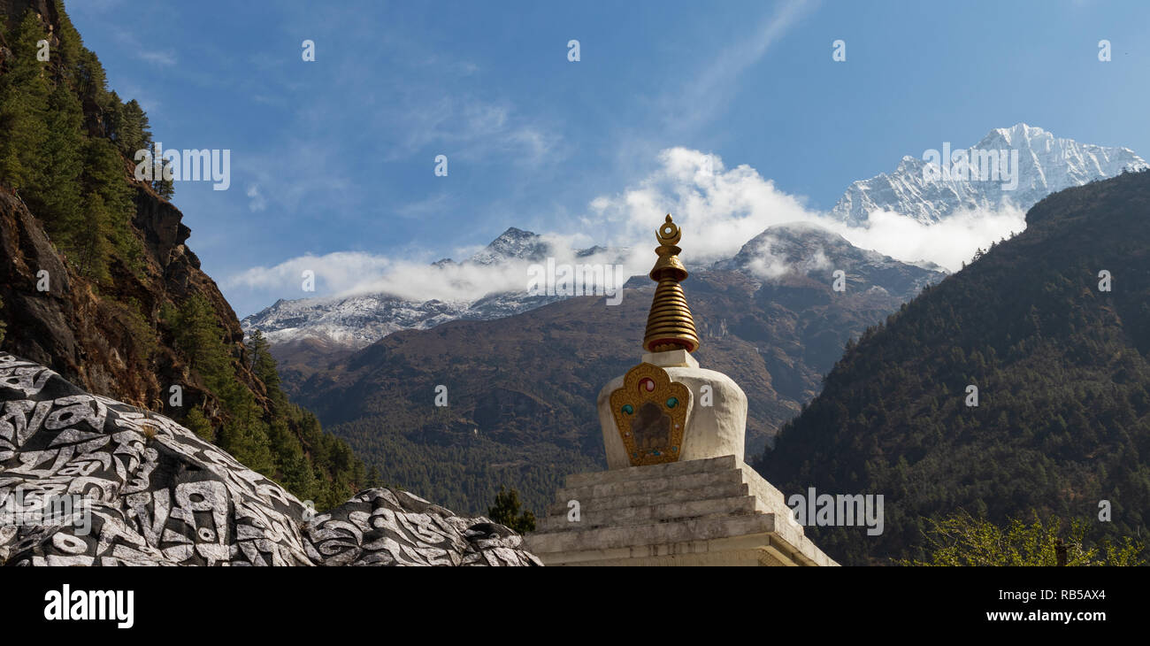 Religious stone and top of temple along the Everest base camp hike in ...