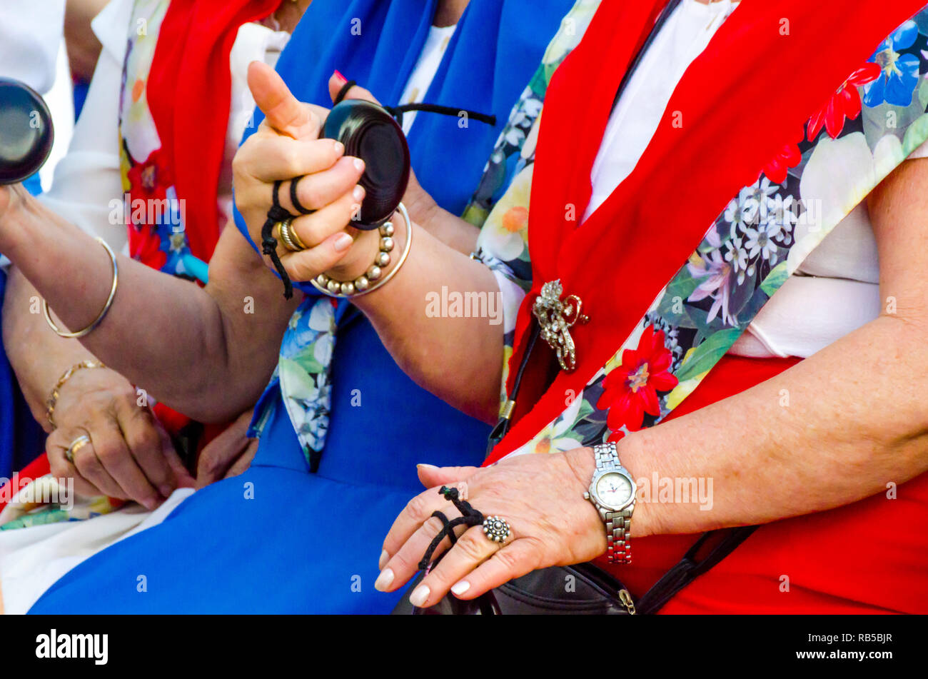 close up hands with castanets of women during the presentation of a ...