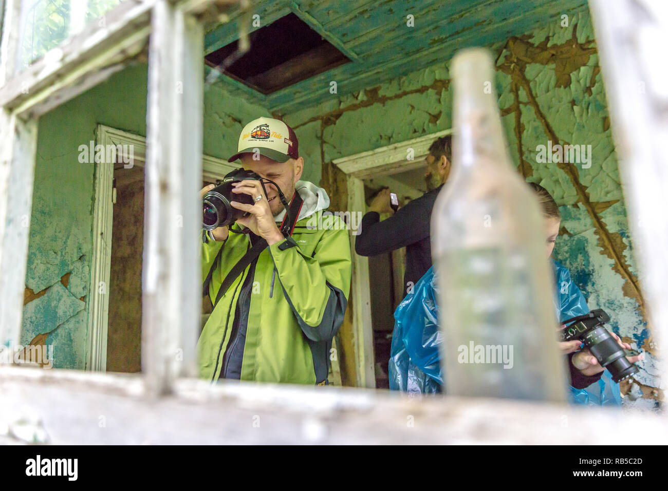 Chernobyl, Ukraine - July 2nd 2018 - Group of tourists taking pictures ...