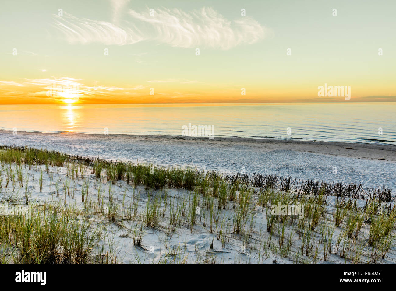 Sandy beach and sunset sky with golden sun shining on white sand Stock ...