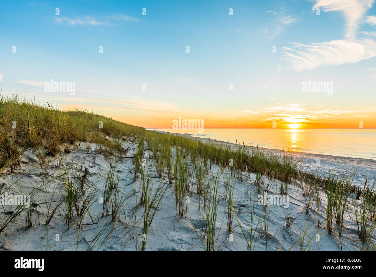 Sandy beach and sunset sky with golden sun shining on white sand Stock ...
