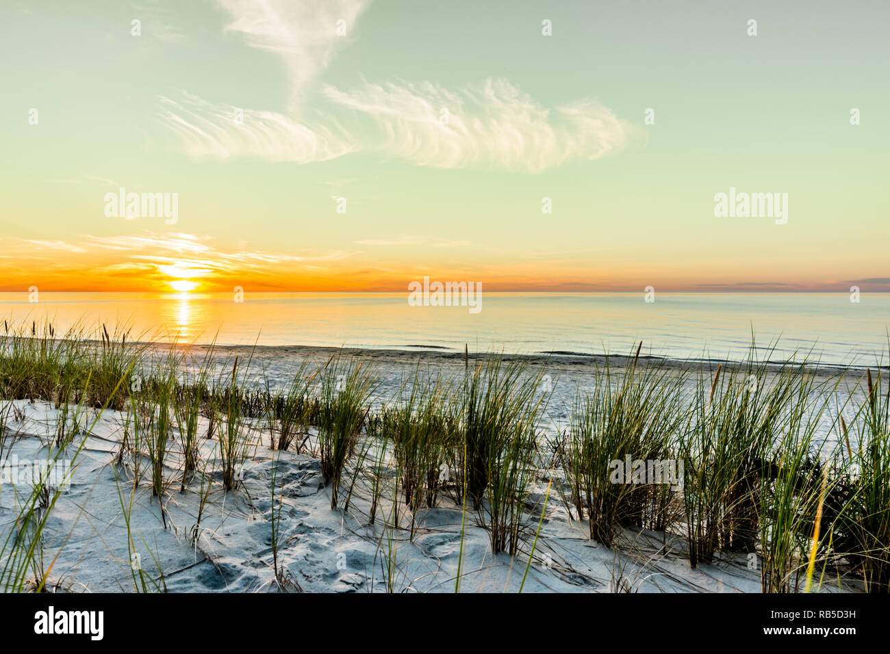 Sandy beach and sunset sky with golden sun shining on white sand Stock ...