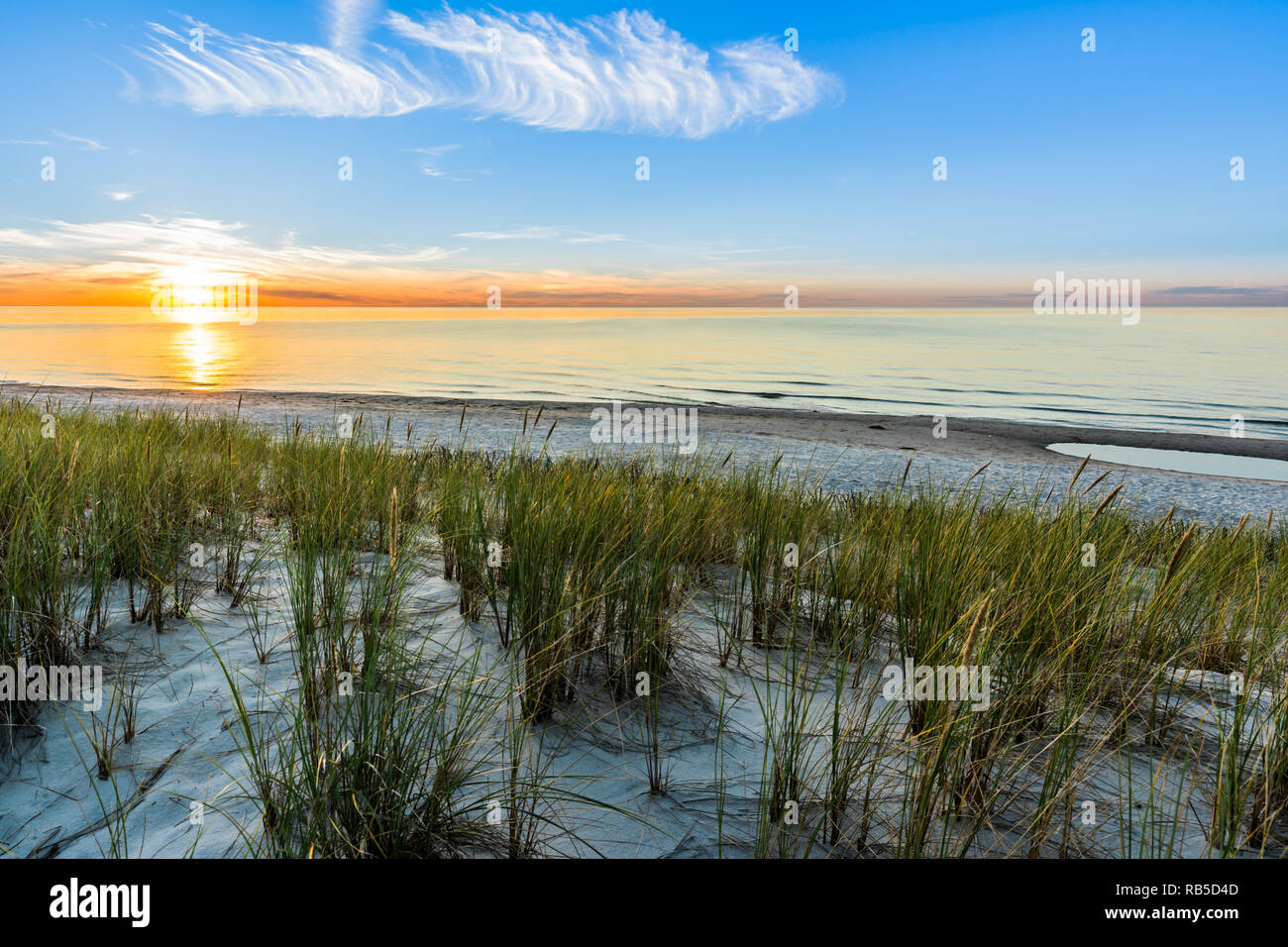 Sandy beach and sunset sky with golden sun shining on white sand Stock ...