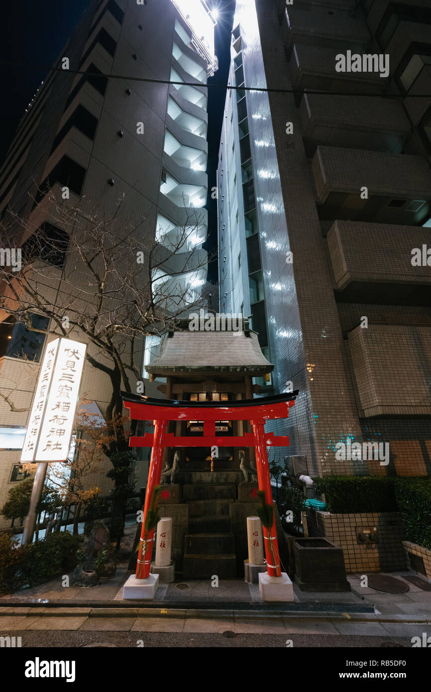 Small shrine betwwen modern buildings in Tokyo, Japan Stock Photo - Alamy