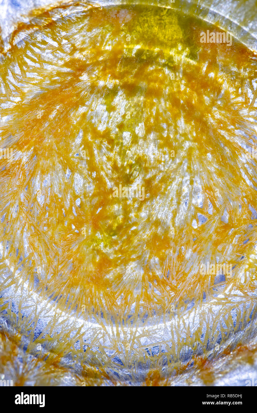 Abstract textures and shapes in yellow crystalized salt background ...