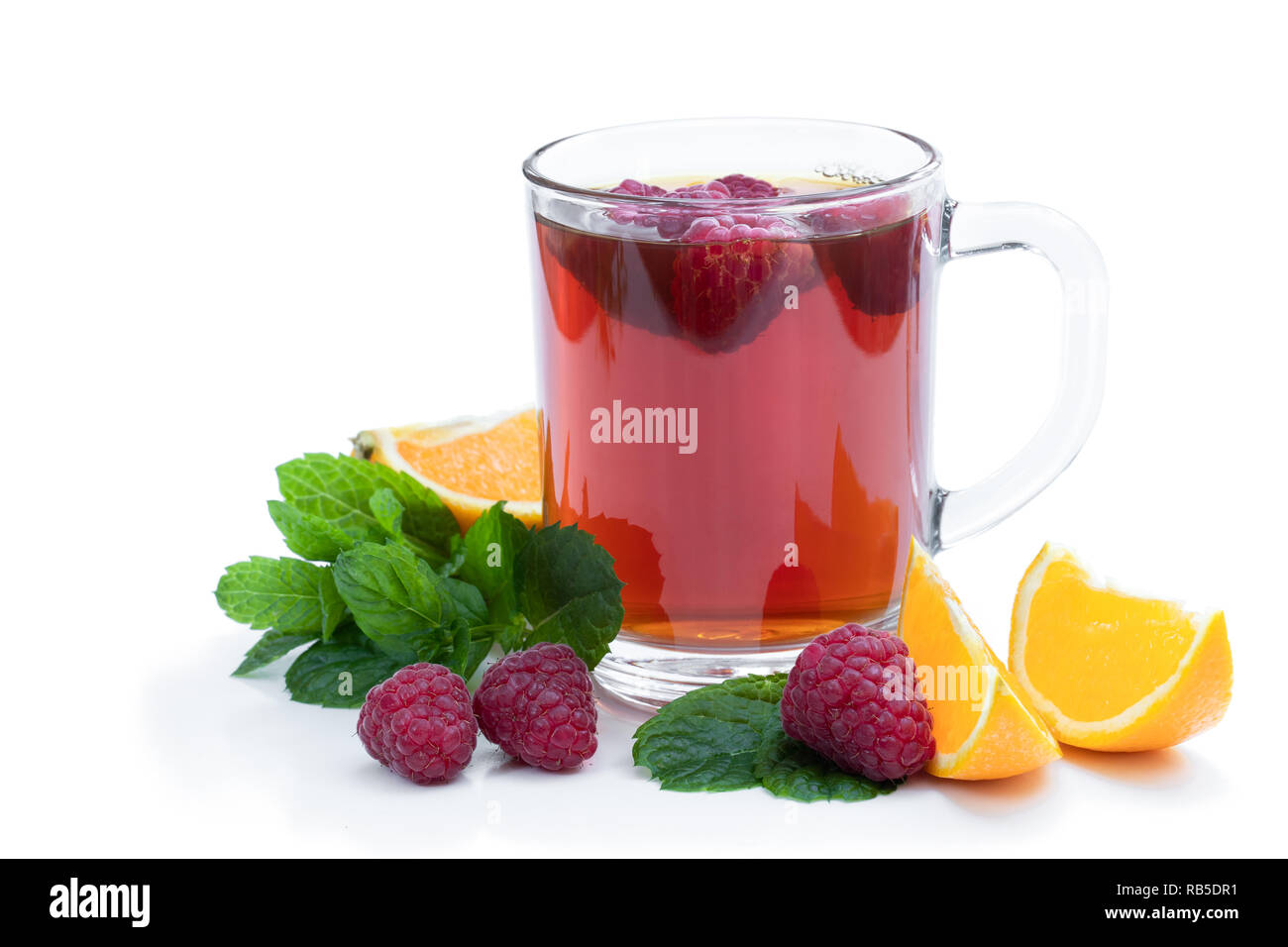 Red fruit tea with raspberry and orange isolated on white background ...