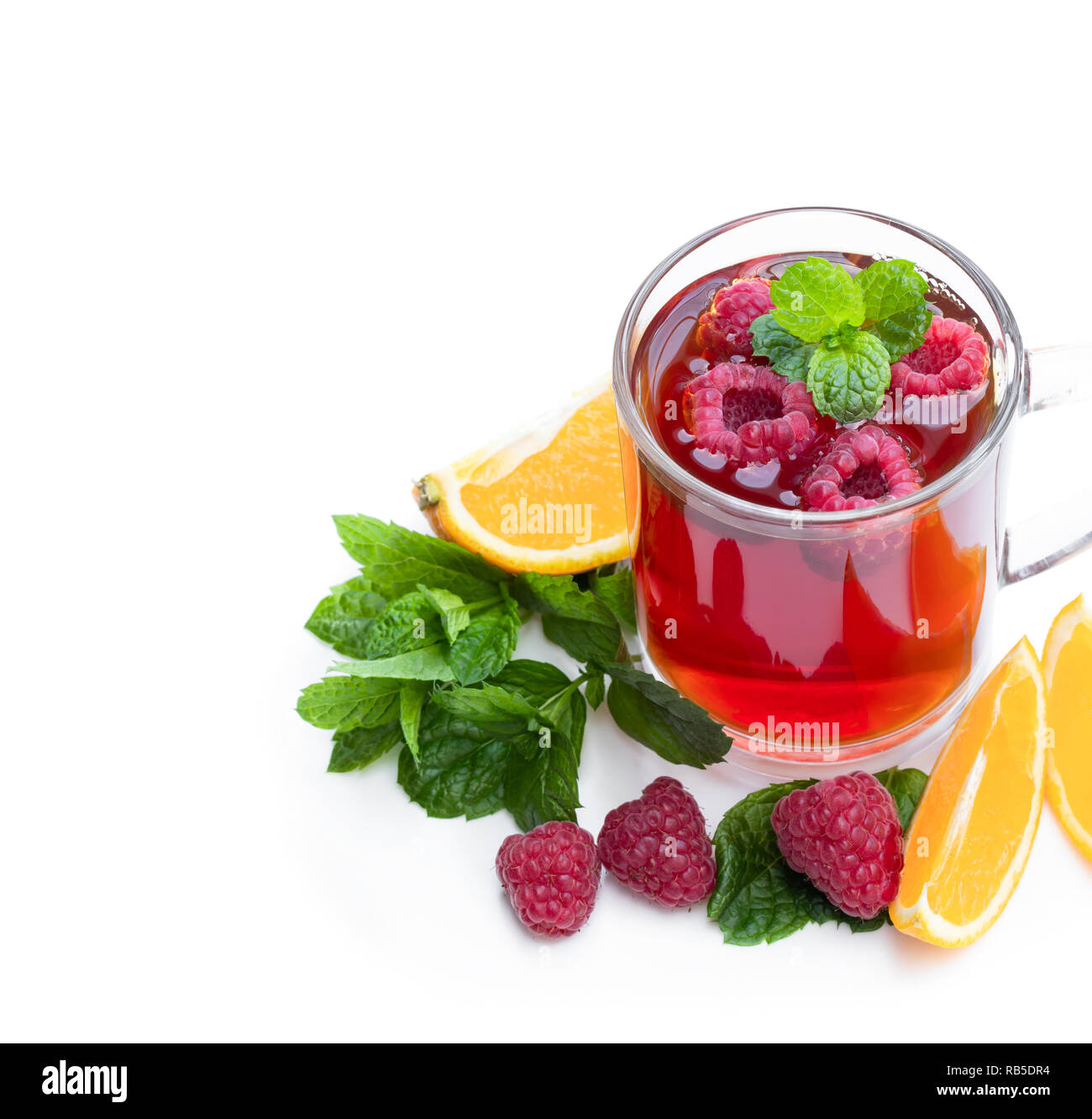 Red fruit tea with raspberry and orange isolated on white background ...