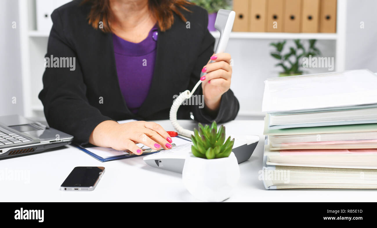 the woman behind the desk in the Office Stock Photo - Alamy