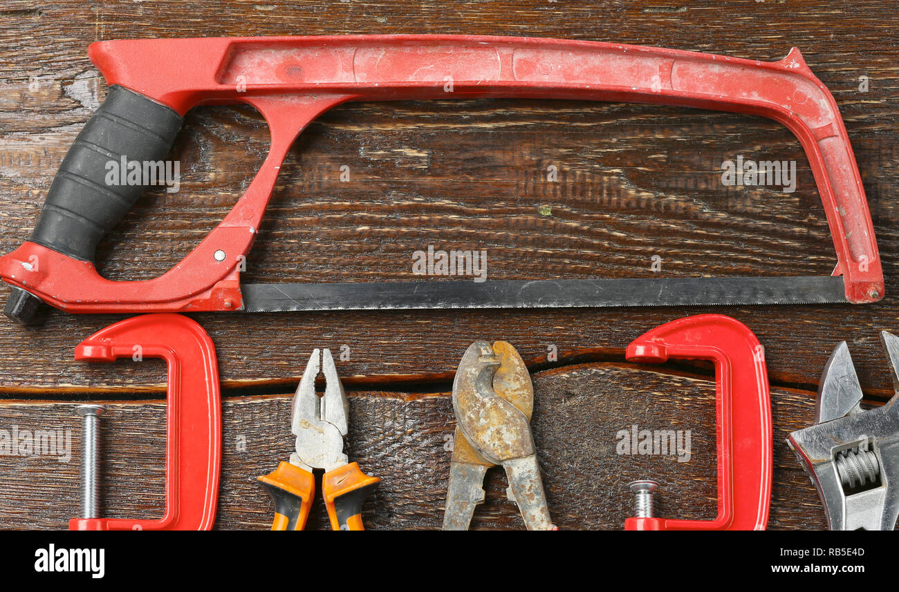 Workshop bench. Variety of hand tools on a wooden table, top view Stock ...