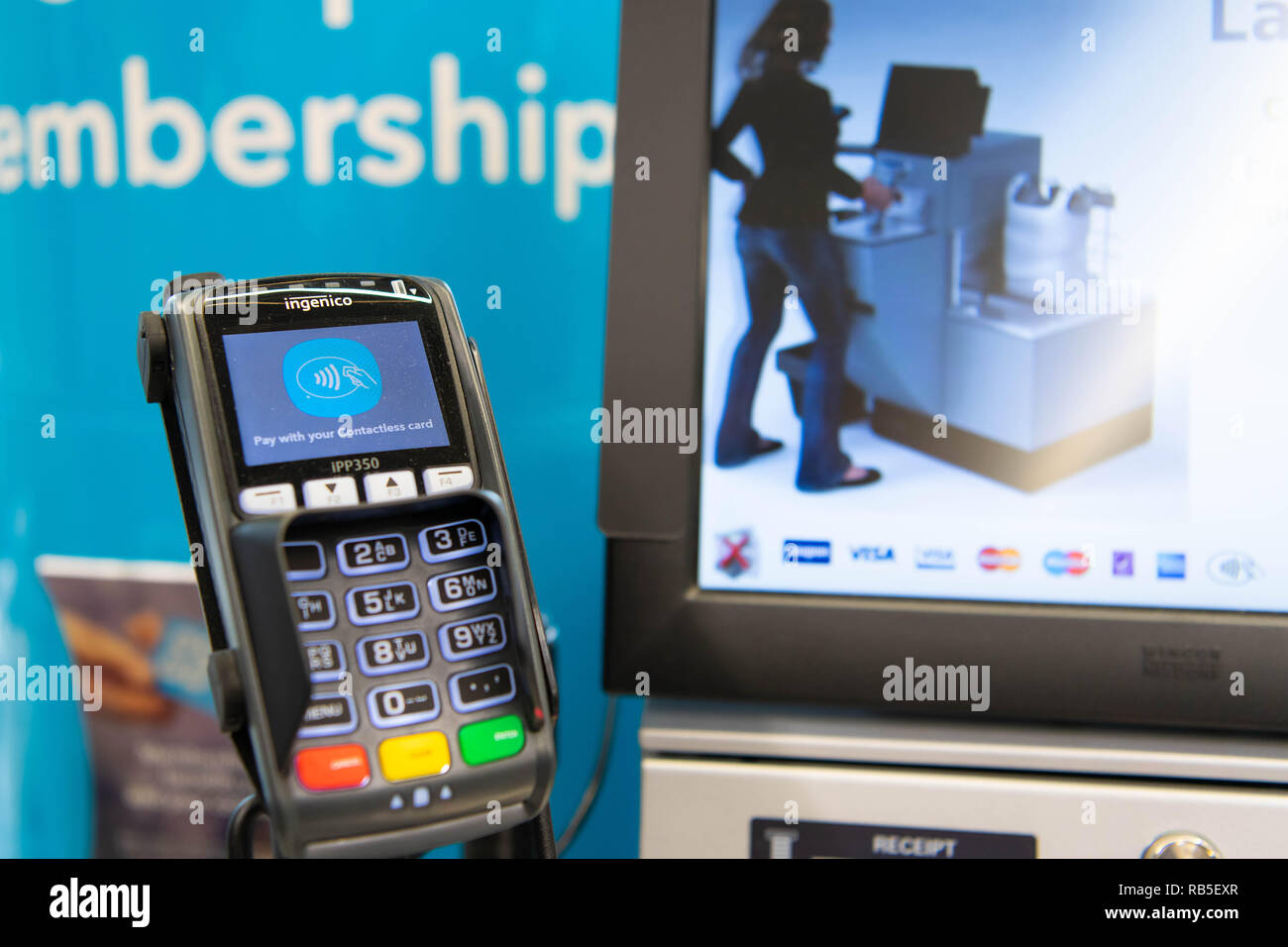 A contactless chip and pin payment terminal in a supermarket shop in ...
