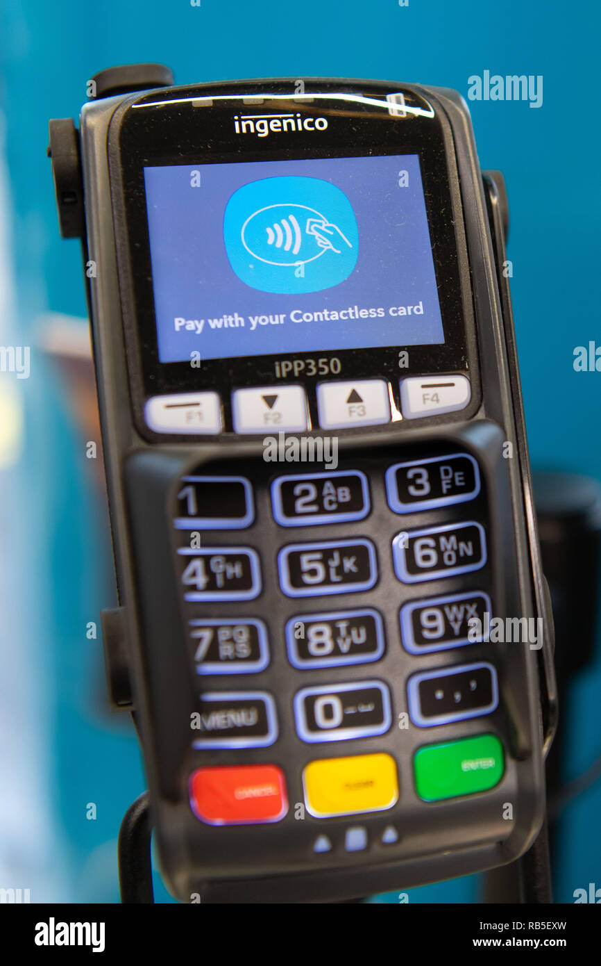 A contactless chip and pin payment terminal in a supermarket shop in ...
