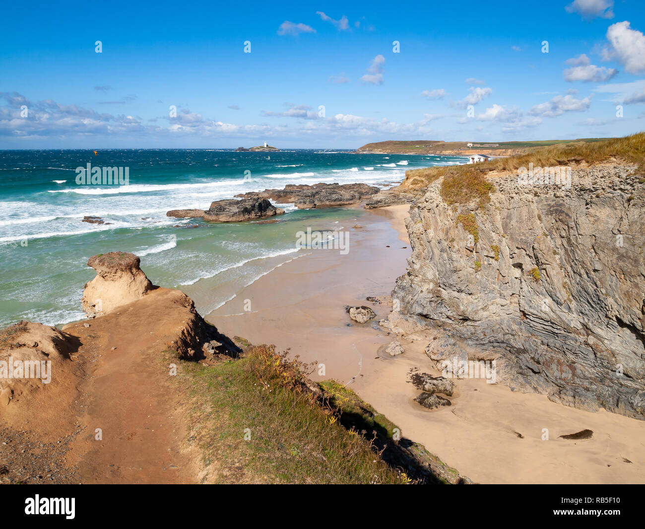 The beautiful golden sandy beach at Gwithian with Godrevy in the ...