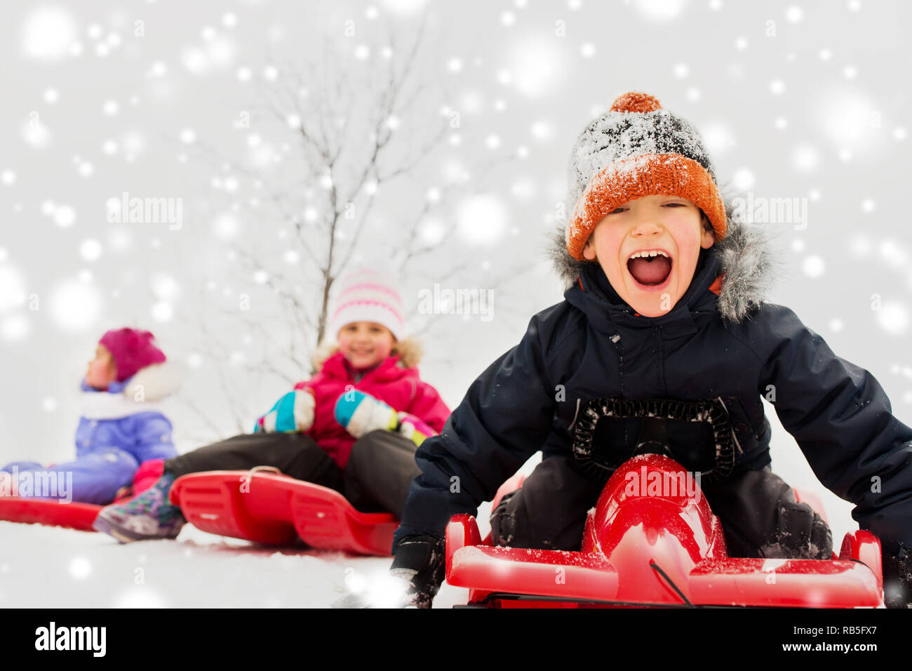 Kids on sleds hi-res stock photography and images - Alamy