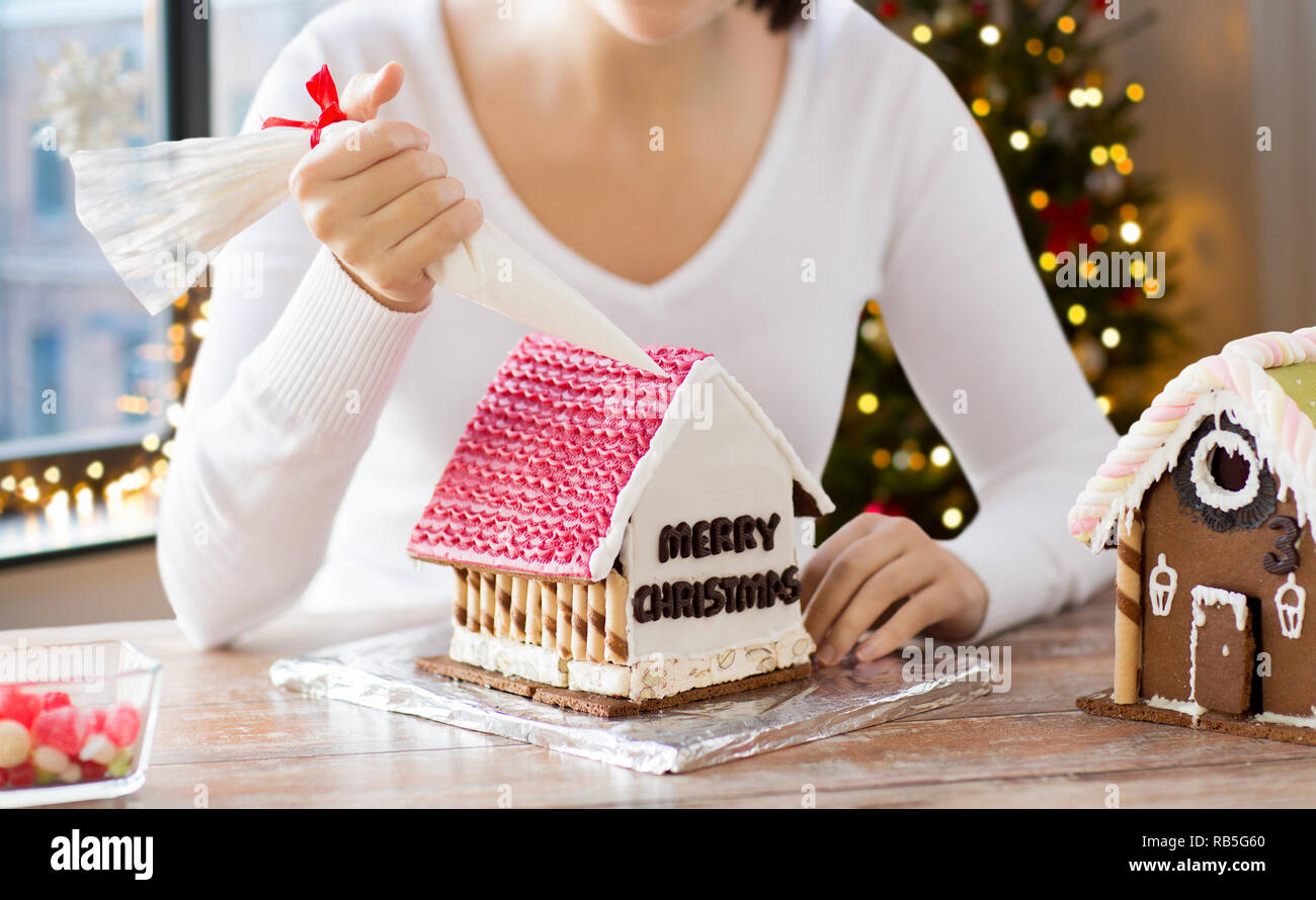 Woman glazing traditional gingerbread hi-res stock photography and ...