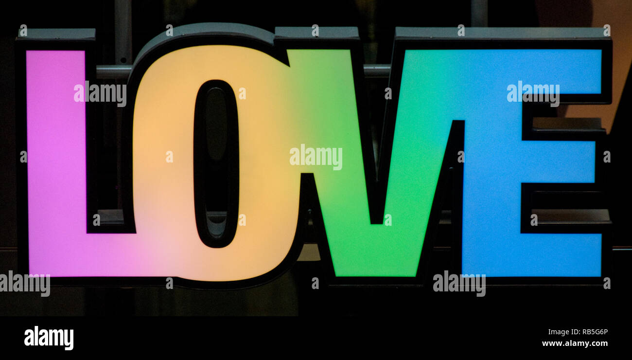 Love neon light letter sign rainbow color Stock Photo - Alamy
