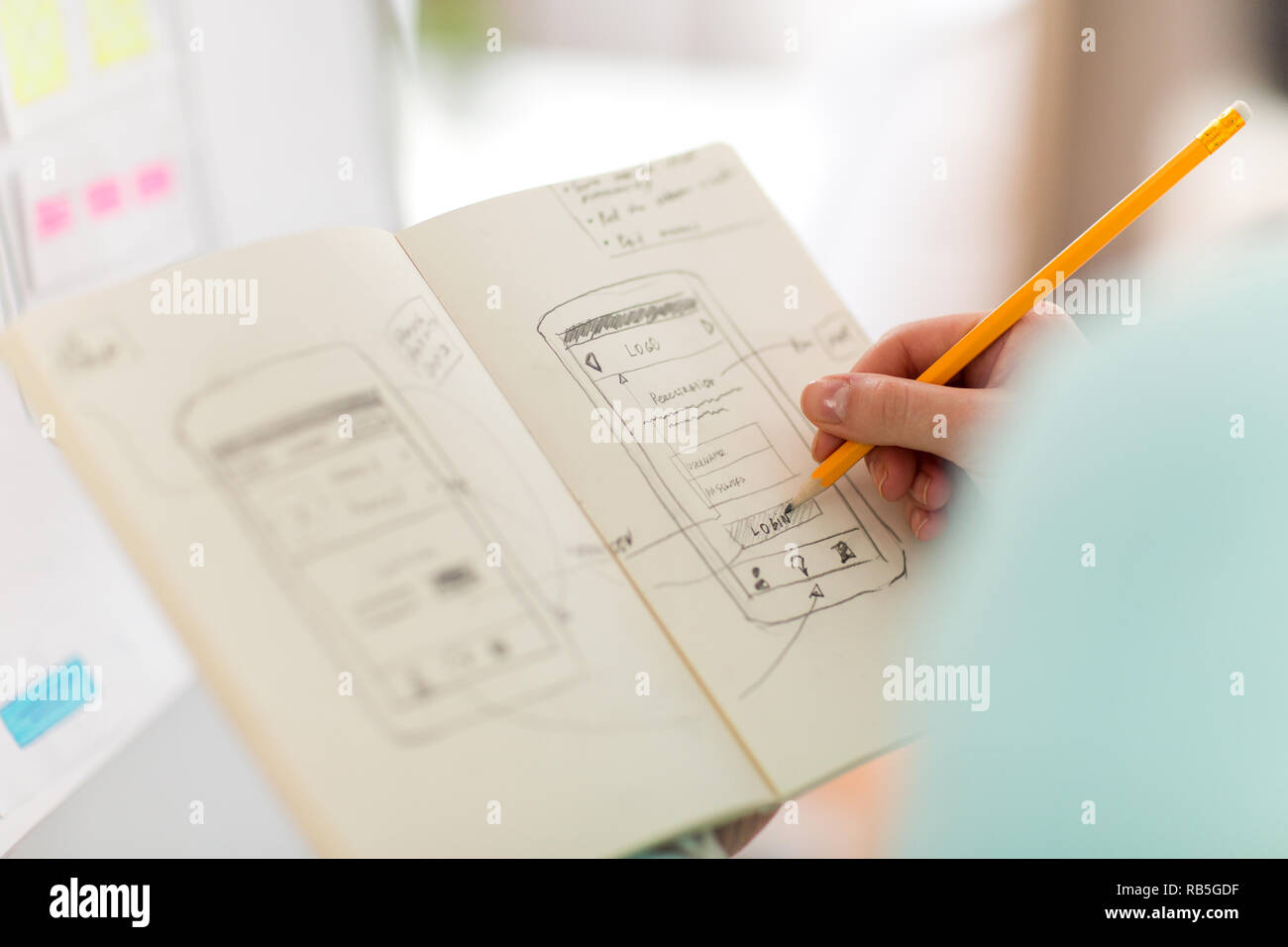 ui designer with user interface sketch in notebook Stock Photo - Alamy