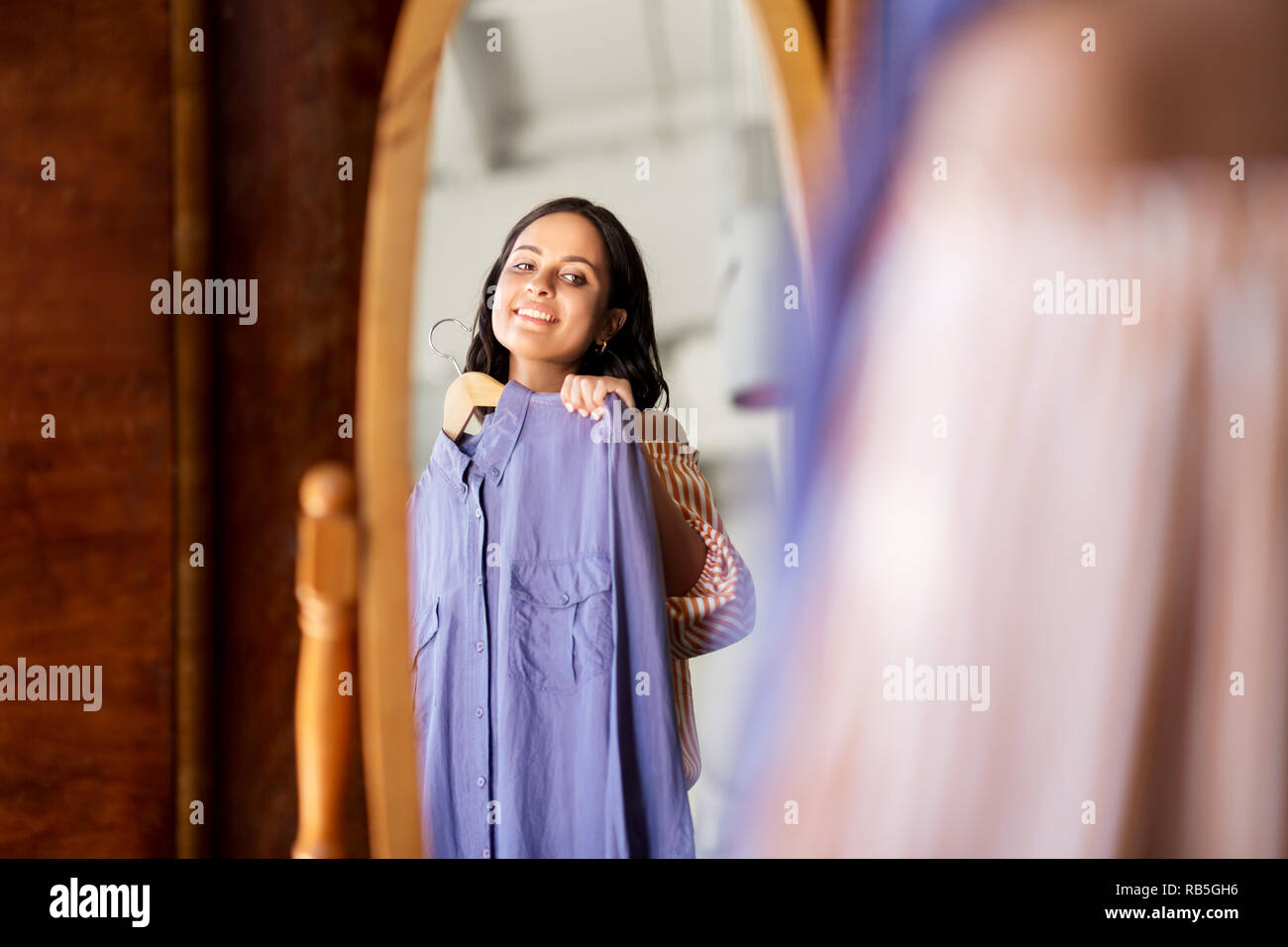 woman with dress at vintage clothing store mirror Stock Photo - Alamy