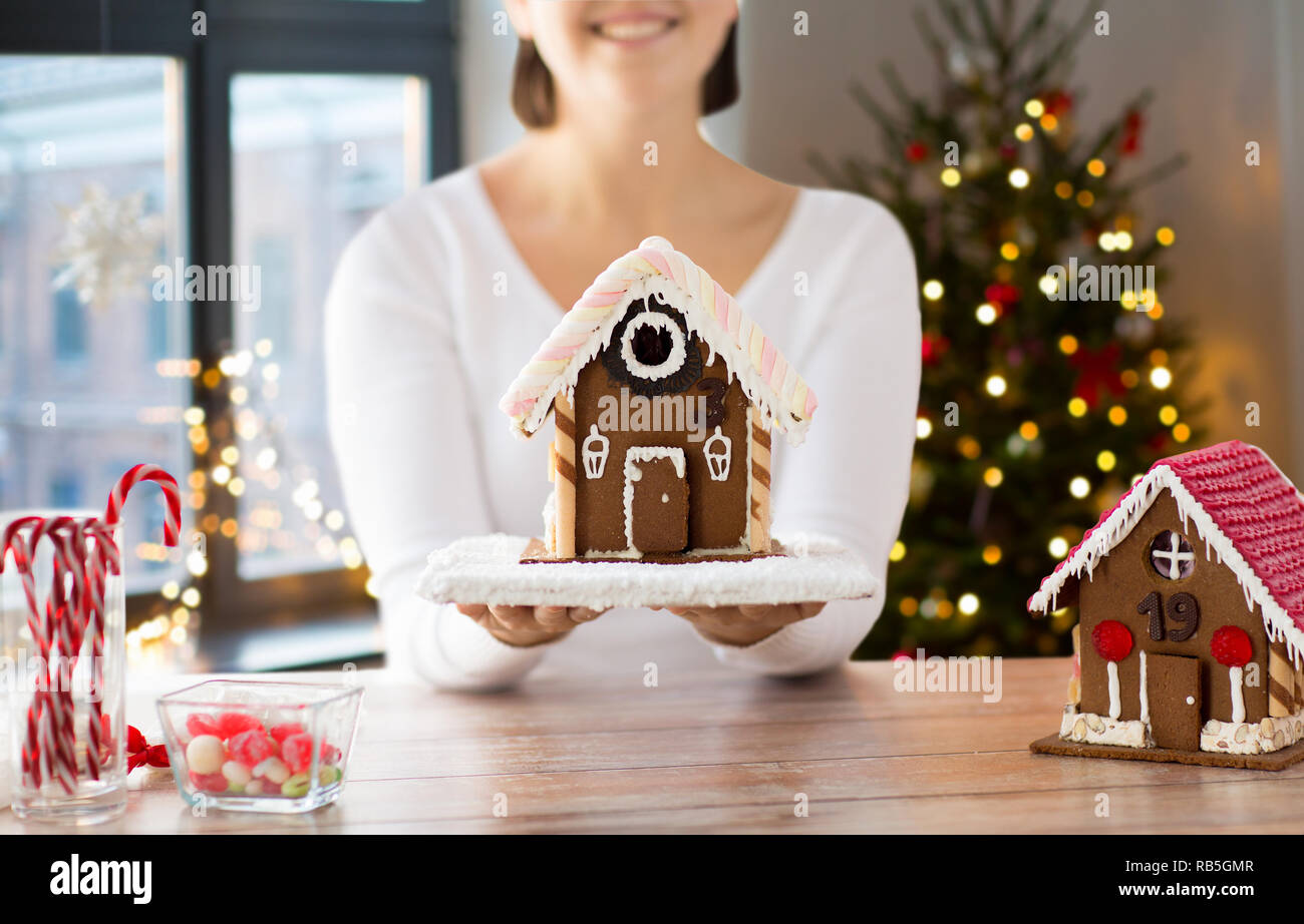 Woman glazing traditional gingerbread hi-res stock photography and ...