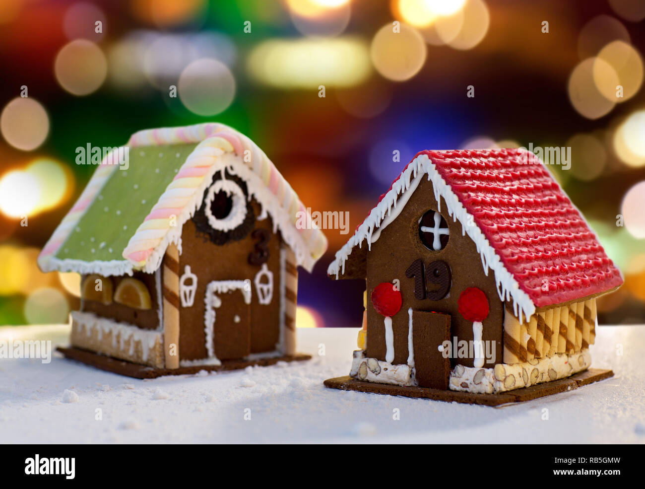 gingerbread houses over christmas lights Stock Photo - Alamy