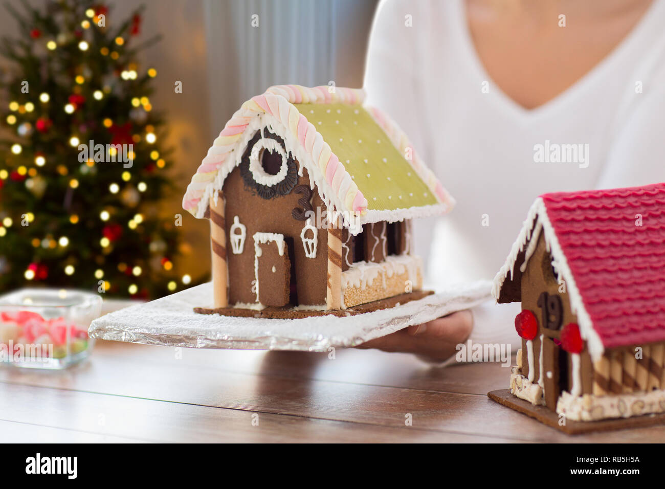 Woman glazing traditional gingerbread hi-res stock photography and ...