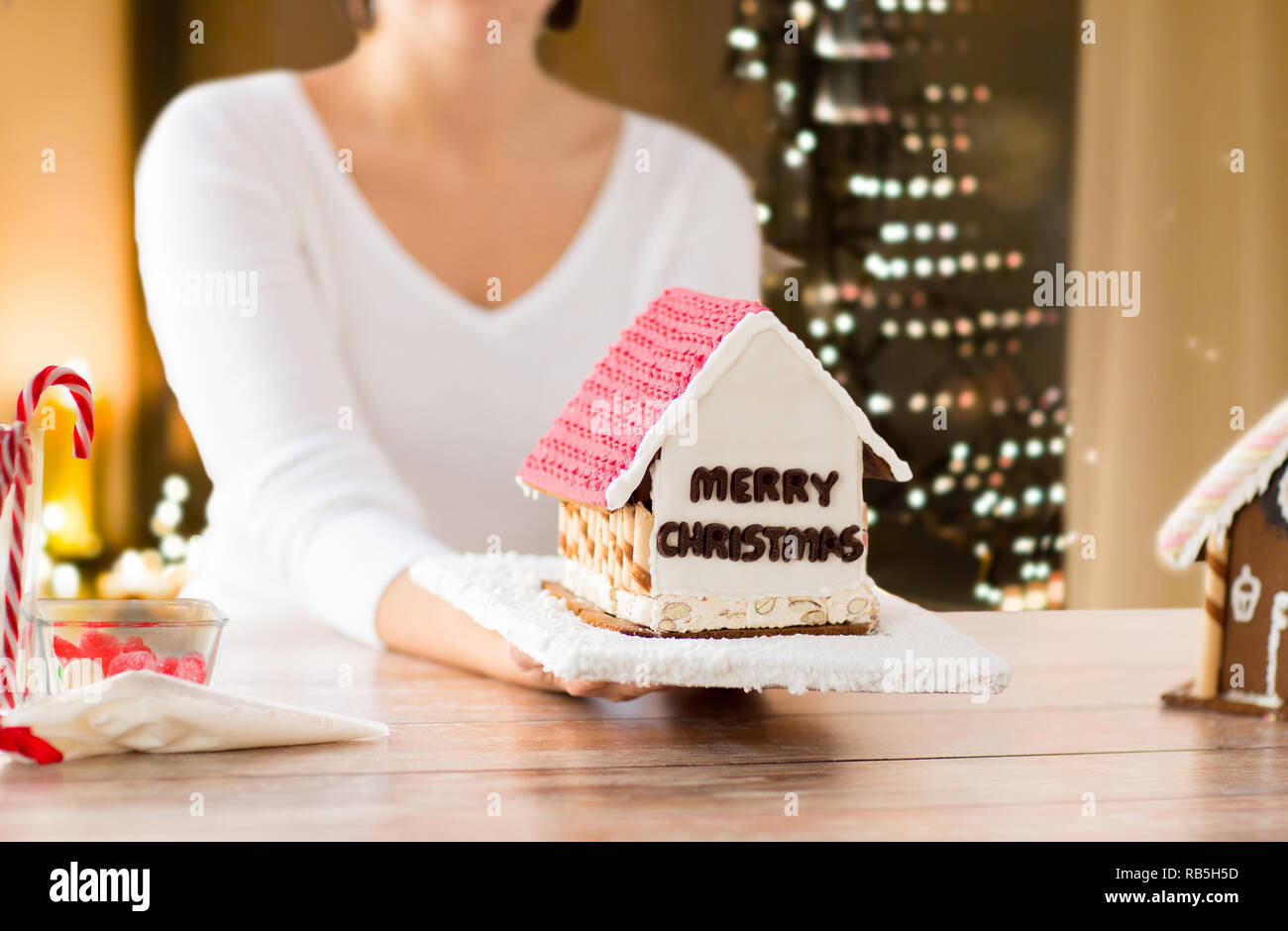 Woman glazing traditional gingerbread hi-res stock photography and ...