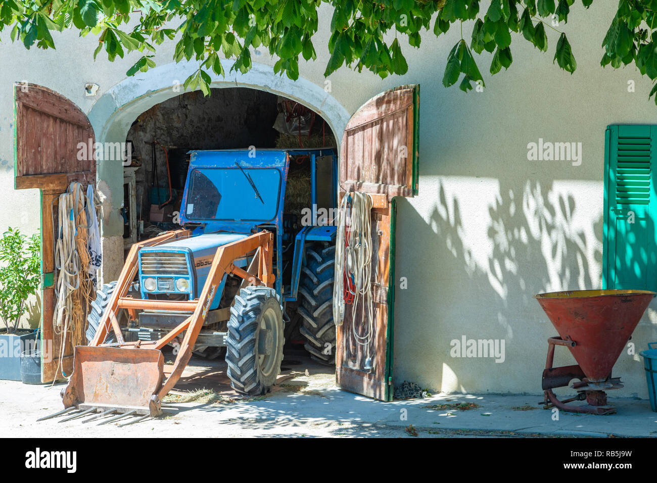 Old trader in a barn Stock Photo - Alamy