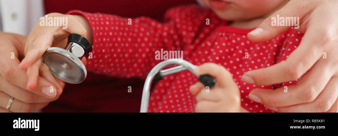 Little child with stethoscope at doctor Stock Photo - Alamy