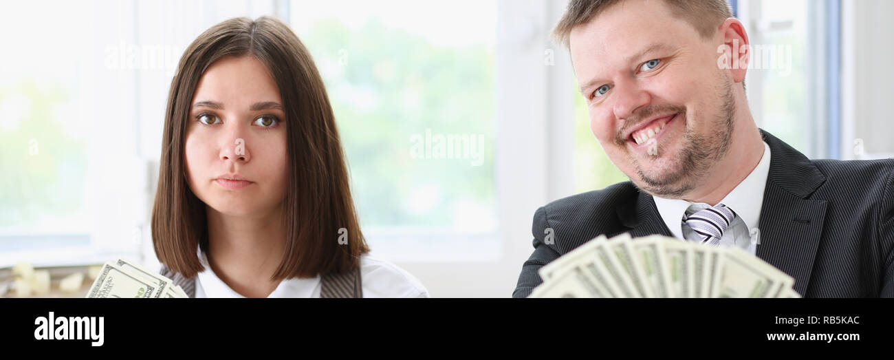 A man and a woman enjoy light money Stock Photo - Alamy
