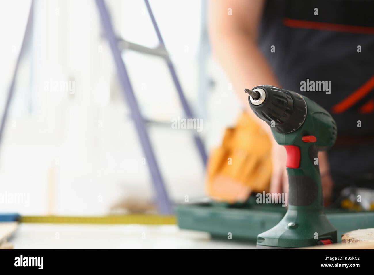Worker using drill create hi-res stock photography and images - Alamy