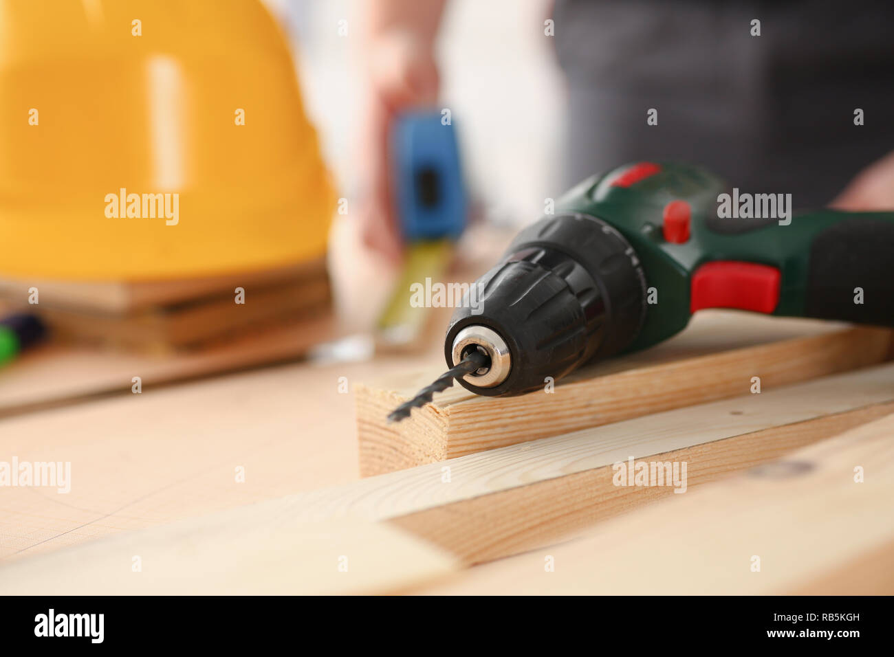 Worker using drill create hi-res stock photography and images - Alamy