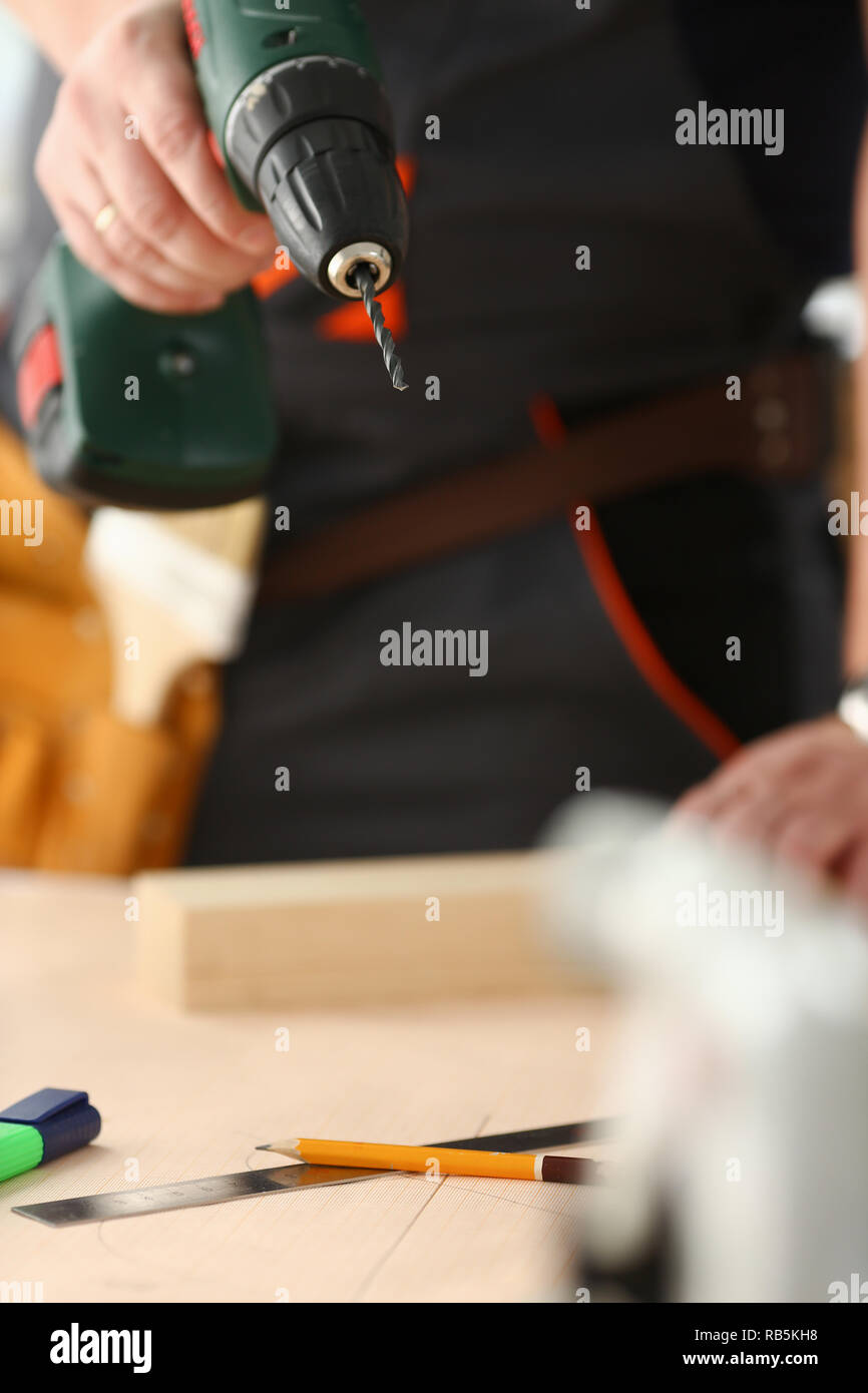Worker using drill create hi-res stock photography and images - Alamy