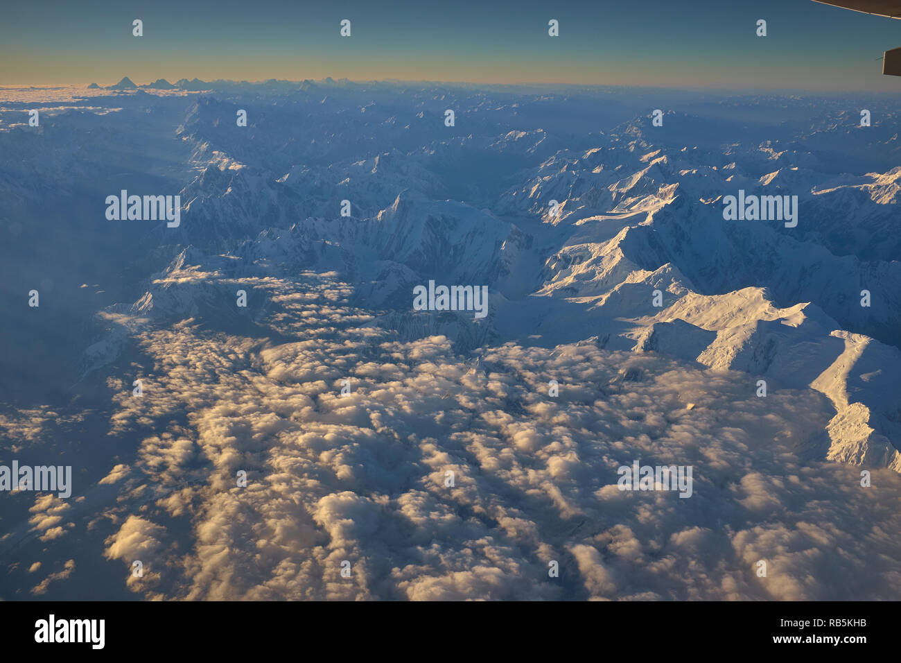 Airplane flying over mountain in China, Tibet Stock Photo - Alamy