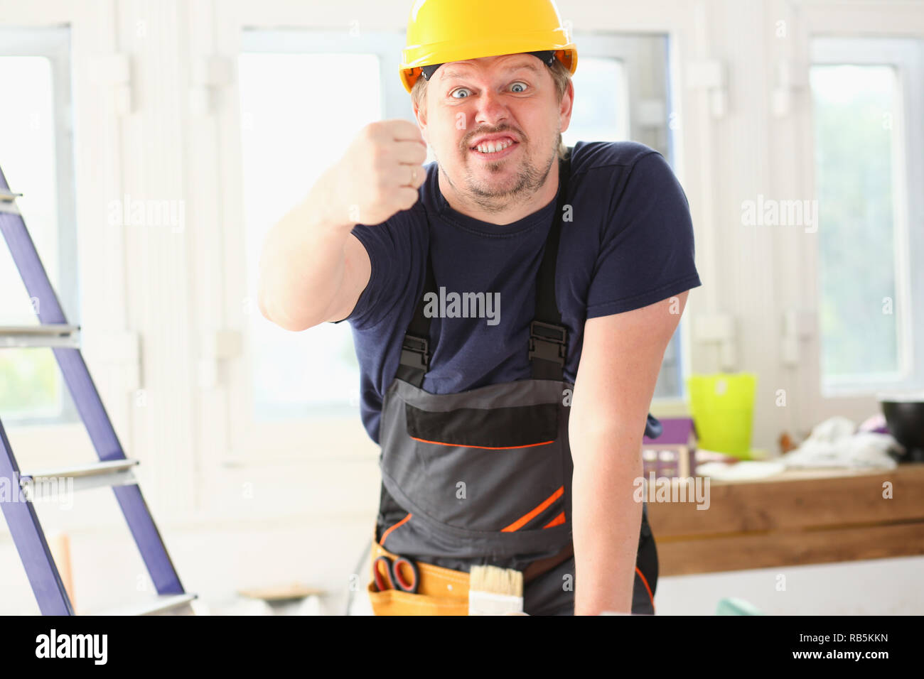 Smiling positive male carpenter hi-res stock photography and images - Alamy