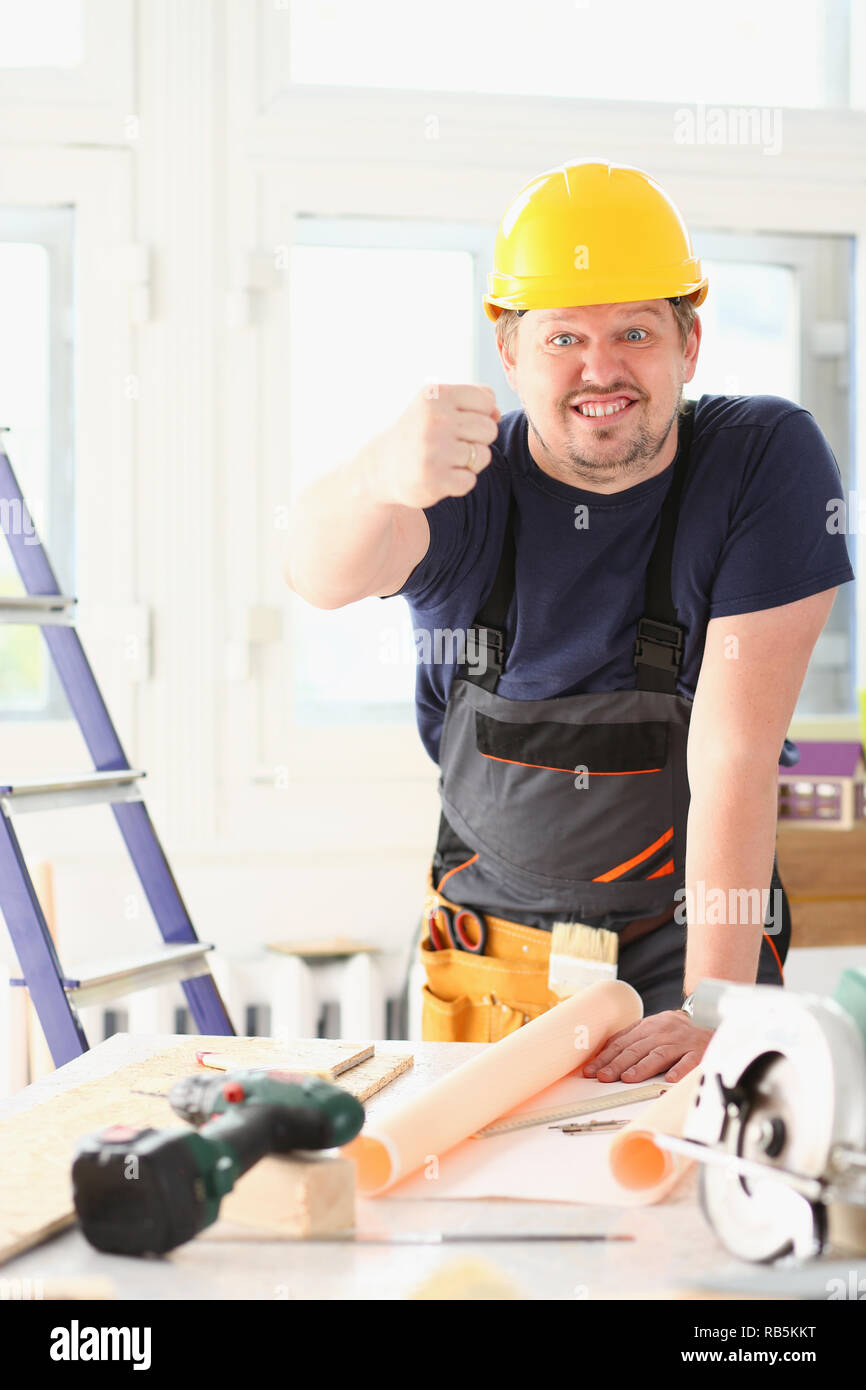 Smiling positive male carpenter hi-res stock photography and images - Alamy