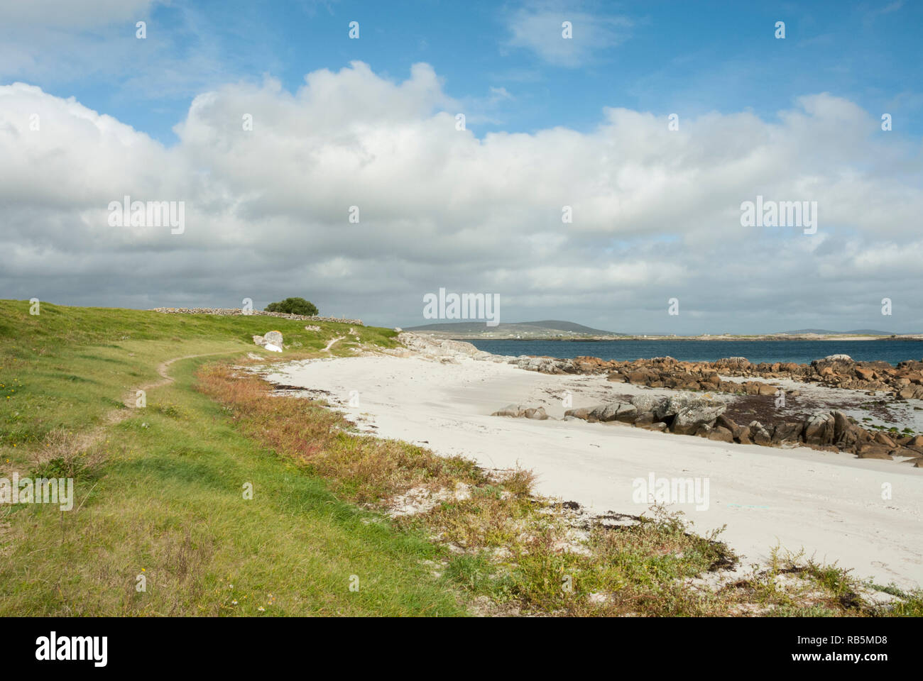 The pristine golden sands of Mweenish Beach on a sunny day in late ...