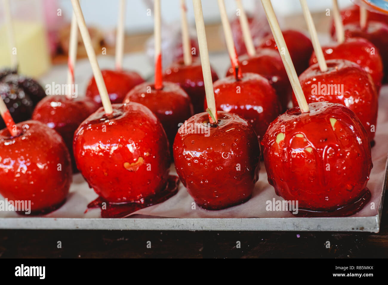 candy apple coated with red caramel candy for sale for kids Stock Photo ...