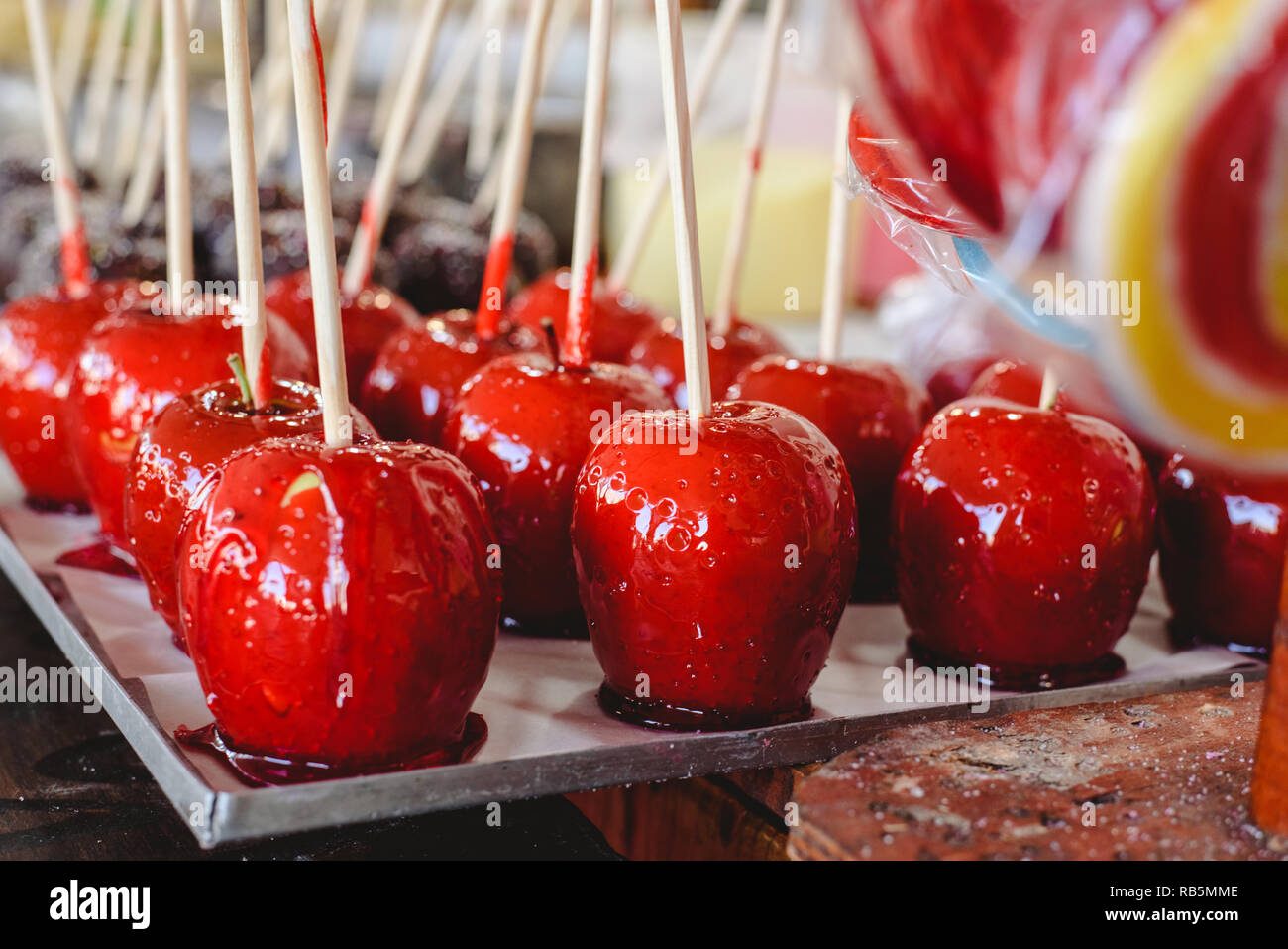 candy apple coated with red caramel candy for sale for kids Stock Photo ...