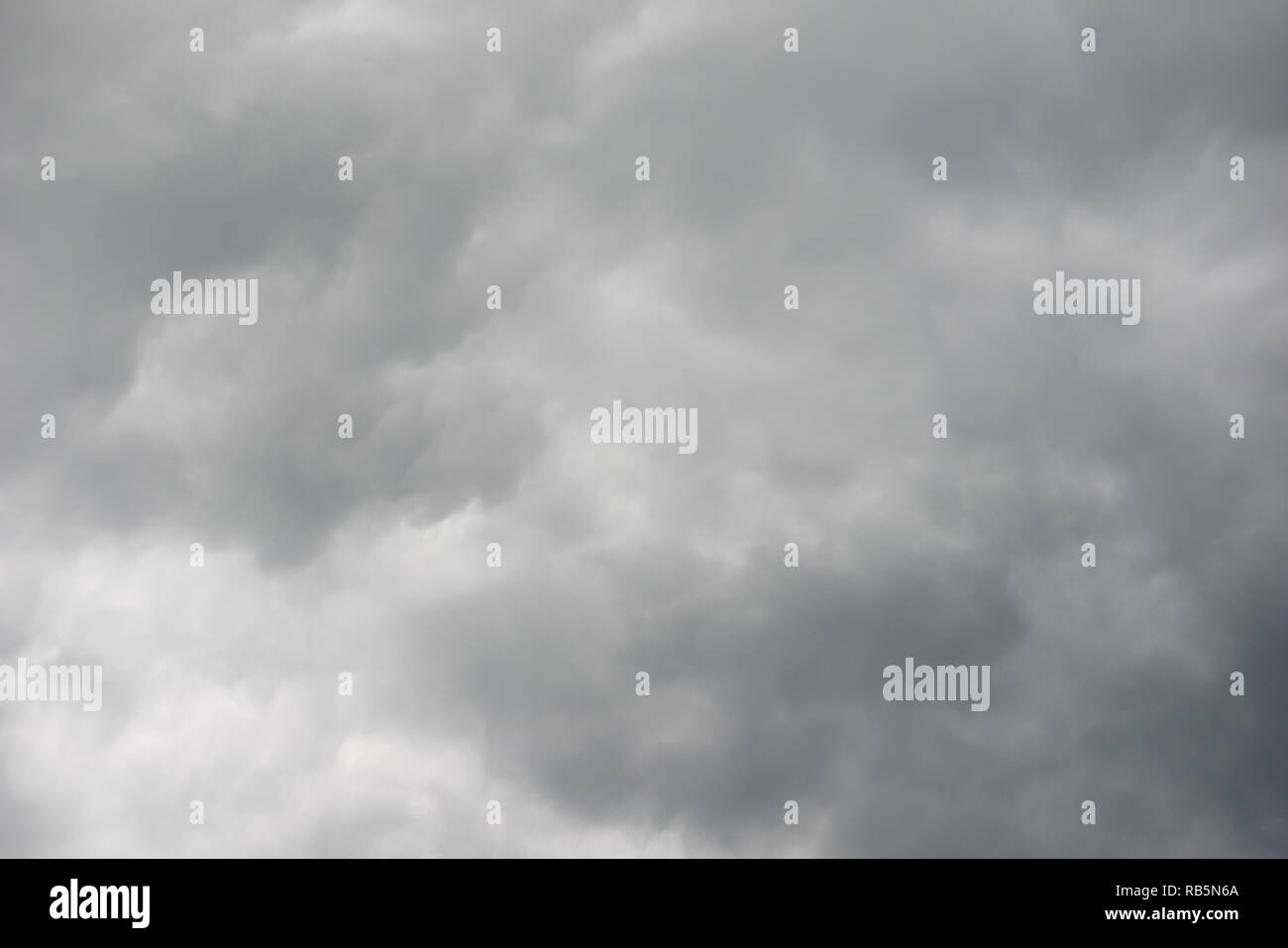 Heavy grey clouds in the sky before the rain - Image Stock Photo - Alamy
