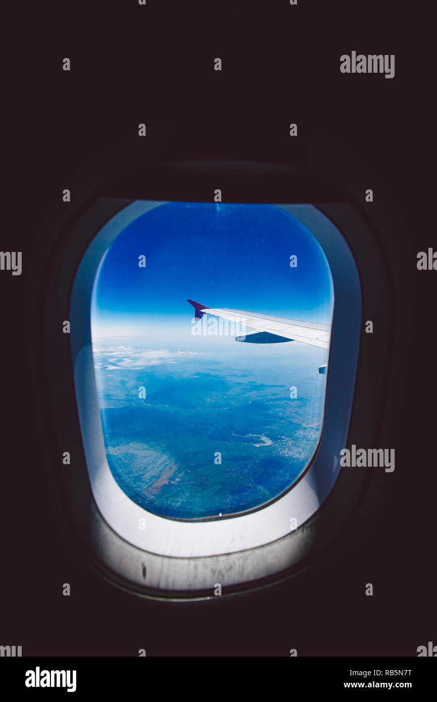 Looking through window aircraft during flight in wing blue sky Stock ...