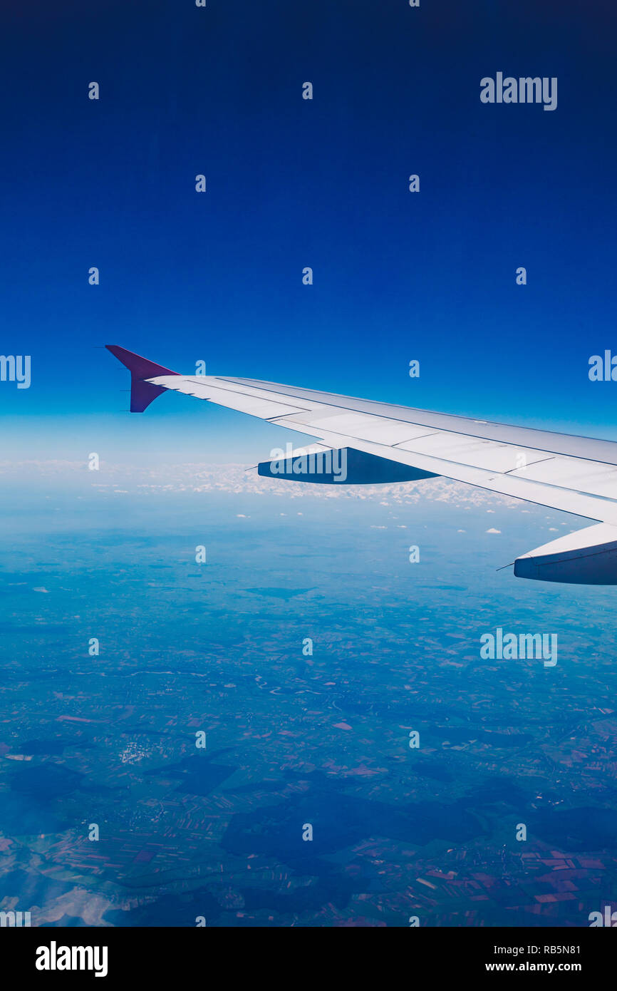 Looking through window aircraft during flight in wing blue sky Stock ...