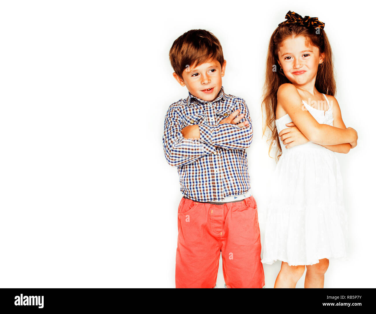 little cute boy and girl hugging playing on white background, ha Stock Photo - Alamy